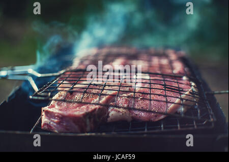 Grilling fresh entrecote pork Stock Photo - Alamy