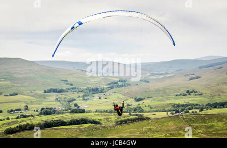 A member of the Dales Hang Gliding and Paragliding Club flies a ...