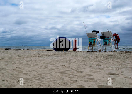 beach lifeguard at Rehoboth Beach, DE, on duty during stormy day with ...