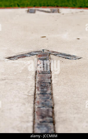 brick paver north arrow compass embedded in concrete Stock Photo - Alamy