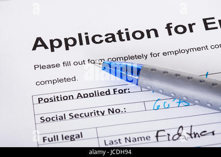 Closeup of filled application of employment and pen Stock Photo - Alamy