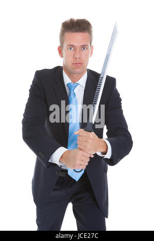 Young Businessman Standing With Sword Over White Background Stock Photo ...