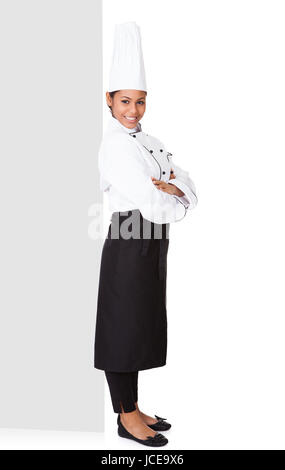 Female Cook Standing Behind The Placard. Isolated On White Stock Photo ...