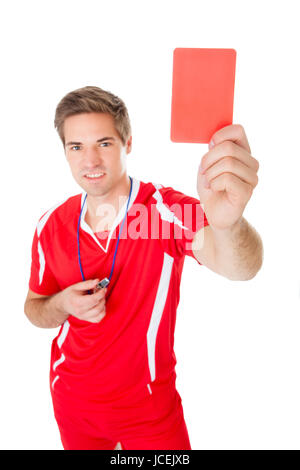 Smiling football referee showing with hand and holding a ball isolated ...