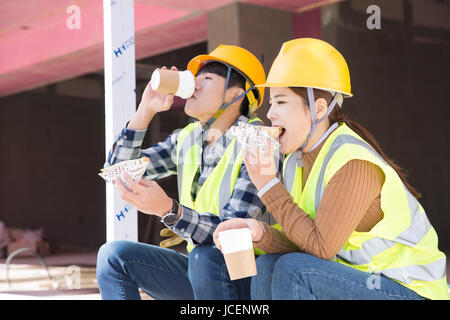 two male construction workers eating sandwiches for lunch Stock Photo ...