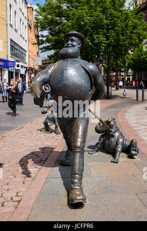 The statue of Desperate Dan in Dundee City Centre alongside a statue of ...
