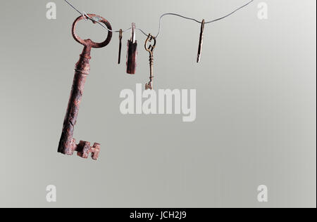 picture of an old keys on a grey background Stock Photo - Alamy