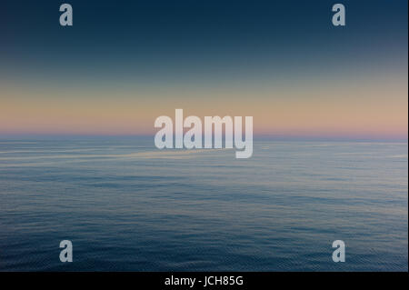 Suble sunset at sea with very calm sea Stock Photo - Alamy