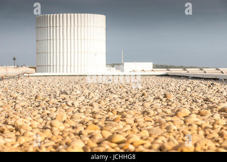 Water reservoir tank and pebbles at foreground Stock Photo - Alamy
