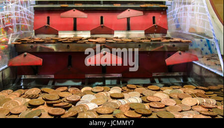 Coin pusher gambling machine Stock Photo - Alamy