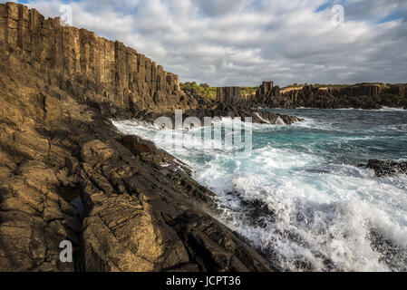 The basalt columns at Bombo Headland Quarry glow in the early morning ...
