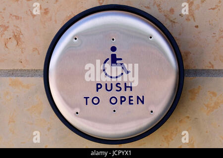 press to open disabled automatic door access to a public building ...