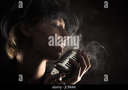 jazz singer woman with cigar and microphone Stock Photo - Alamy