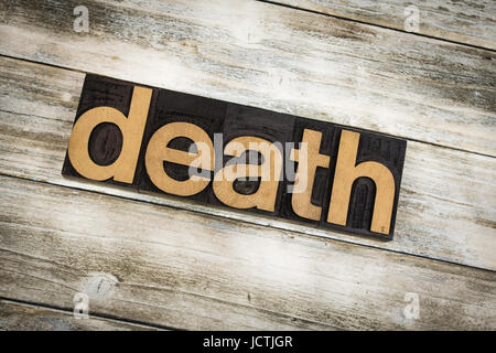 The word "Death" written in white tiles against a dark vintage grunge ...