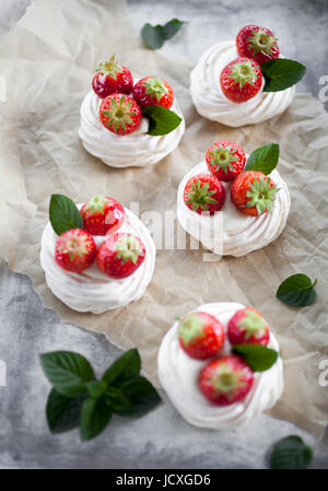 Delicious mini Pavlova meringue nest with blueberry and mint leaves ...