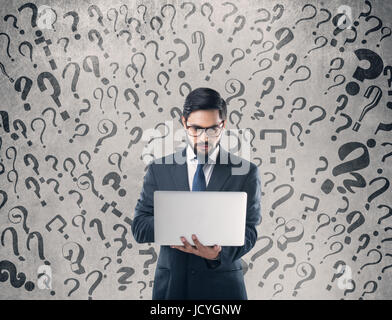 Businessman trying to solve the problems Stock Photo: 145664568 - Alamy