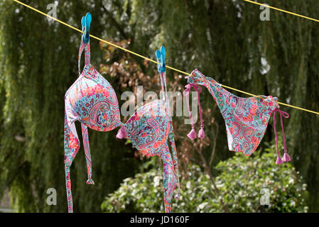 A colorful bikini hanging on a washing line Stock Photo - Alamy