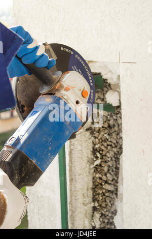 Hands holding construction tools on beige background Stock Photo - Alamy