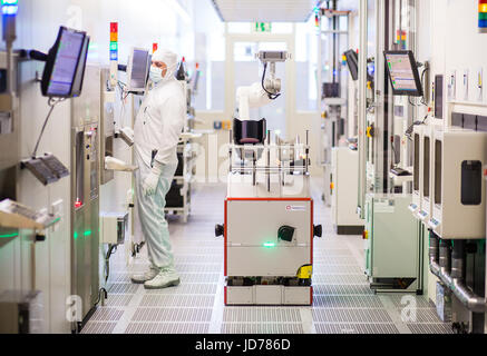 Reutlingen, Germany. 16th June, 2017. Workers inspect semiconductors in ...