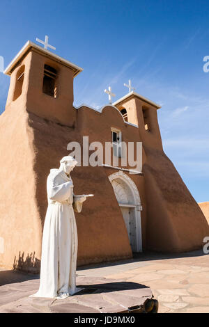 Catholic priest in front of the cross of the St. Thomas Christians, Mar ...