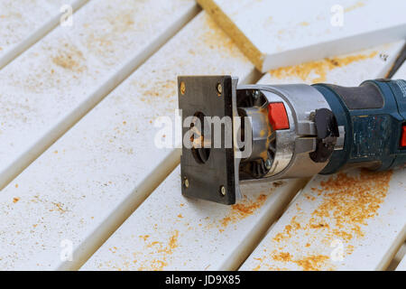 variable speed plunge router on sawdust background Stock Photo - Alamy