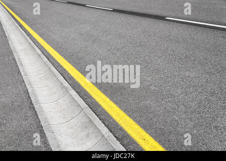 Drain concrete channel on the asphalt road Stock Photo - Alamy