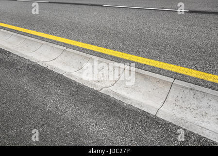 Drain concrete channel on the asphalt road Stock Photo: 145938704 - Alamy