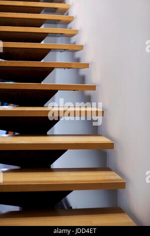 Close up of modern wooden stairs with wooden banister Stock Photo - Alamy