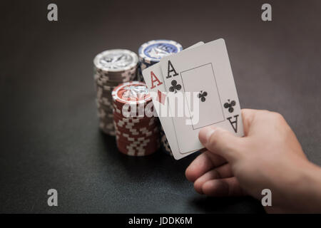 Man's hands show his winner hands, aces card Stock Photo - Alamy