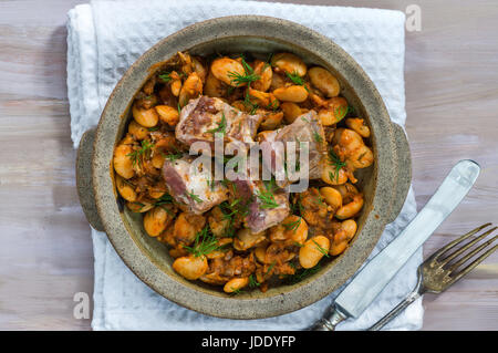 Seared lamb with beans - top view Stock Photo - Alamy