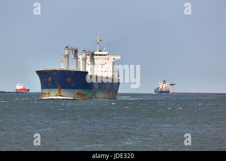 Industrial ship coming in port Stock Photo - Alamy