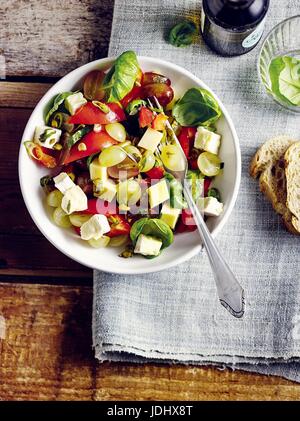 Blue cheese slice with salad leaves Stock Photo - Alamy