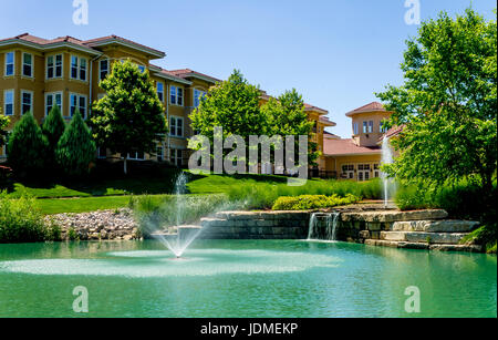 A waterfall flowing at park. A waterfall of a fountain in a garden ...