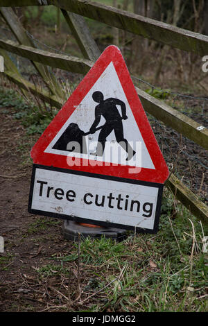 Tree cutting men at work warning signs, in the woods for walkers Stock ...