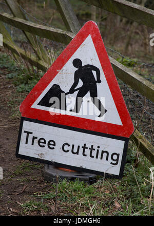 Tree cutting men at work warning signs, in the woods for walkers Stock ...