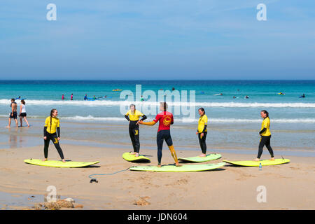 Surfing lessons in Cornwall Stock Photo - Alamy