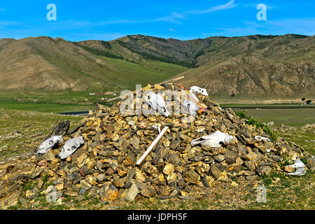 Mongolian sacred cairn or ovoo & prayer flags to worship mountains, sky ...