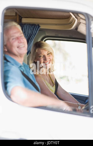 Senior adult woman driving RV and smiling Stock Photo - Alamy