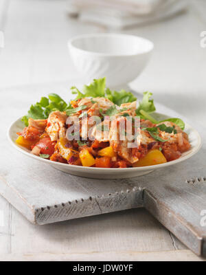 Vertical shallow focus of a delicious chicken Alfredo pasta in a bowl ...