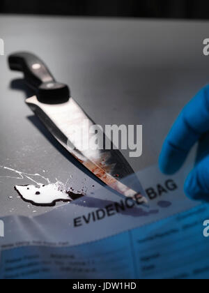 Studio shot of a bloody knife in plastic bag Stock Photo - Alamy