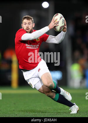 Elliot Daly of the British & Irish Lions is held by Western Forces' Ben ...