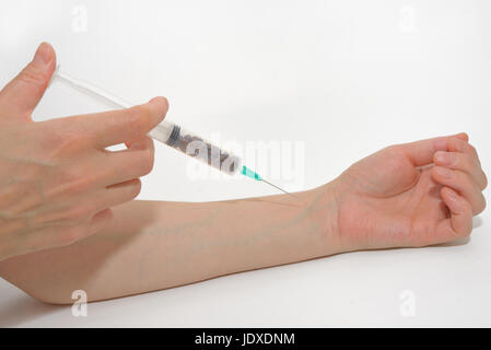 Coffee beans in syringe acting injection Stock Photo - Alamy