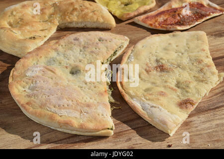 variety of stuffed pizzas with vegetable and ham Stock Photo - Alamy