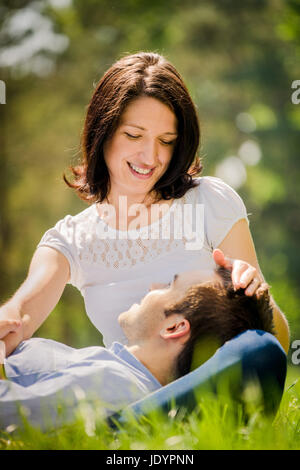Man caressing woman's hair Stock Photo - Alamy