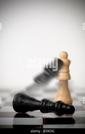 chess game king knocked over covered with a floating one hundred dollar ...