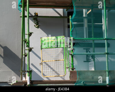 Scaffolding and a ladder access safety gate on a building site Stock ...