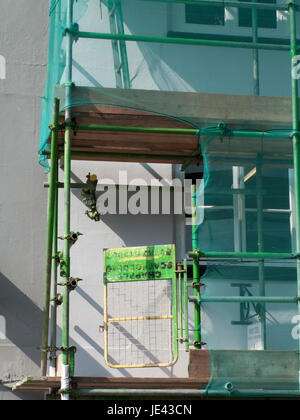 Scaffolding and a ladder access safety gate on a building site Stock ...