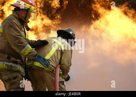 fire fighter fighting inferno Stock Photo - Alamy