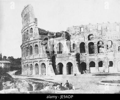 This historical photograph shows Calvert Richard Jones seated with a ...