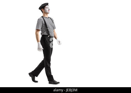 Full length shot of a mime walking and waving isolated on white ...
